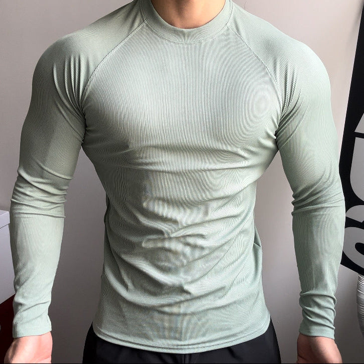 Muscular man sports long sleeves